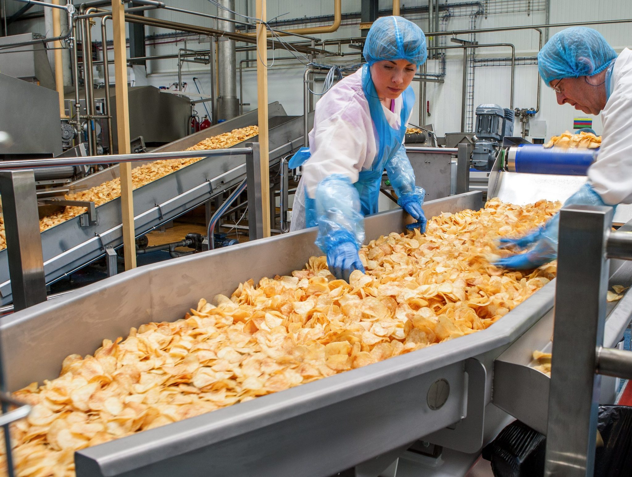 The Benefits of an Oil Spray System in Snack Manufacturing - KMG Systems